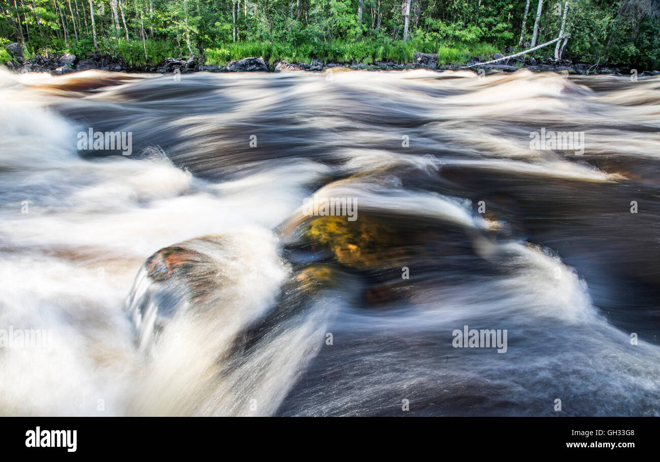 Fast moving river in Finish Lapland Stock Photo - Alamy