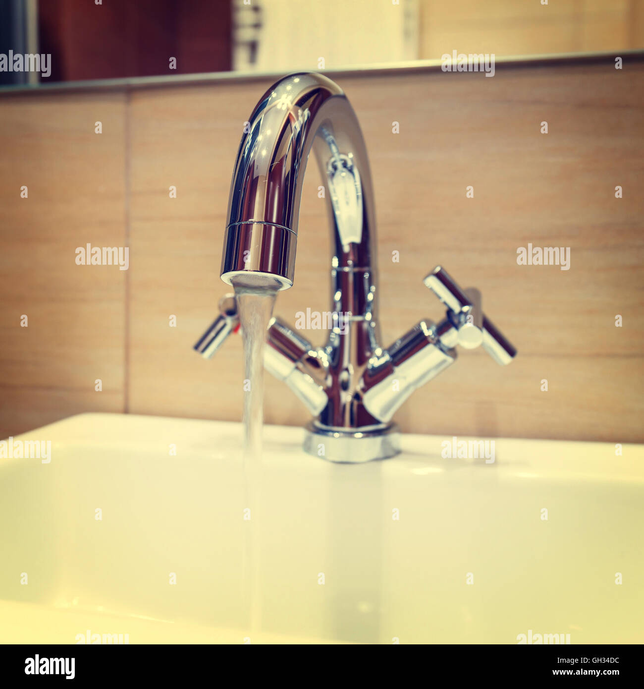 water tap with modern design in bathroom, vintage look Stock Photo - Alamy