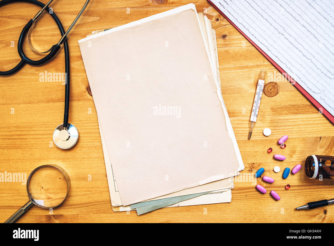 Assorted office supplies on doctor's desk. General medical practitioner ...