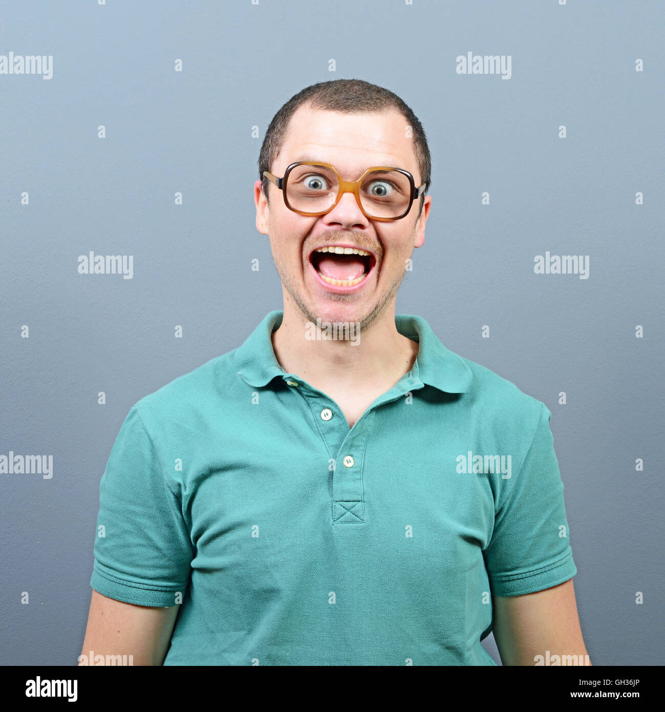Amazed man having reaction about something Stock Photo - Alamy