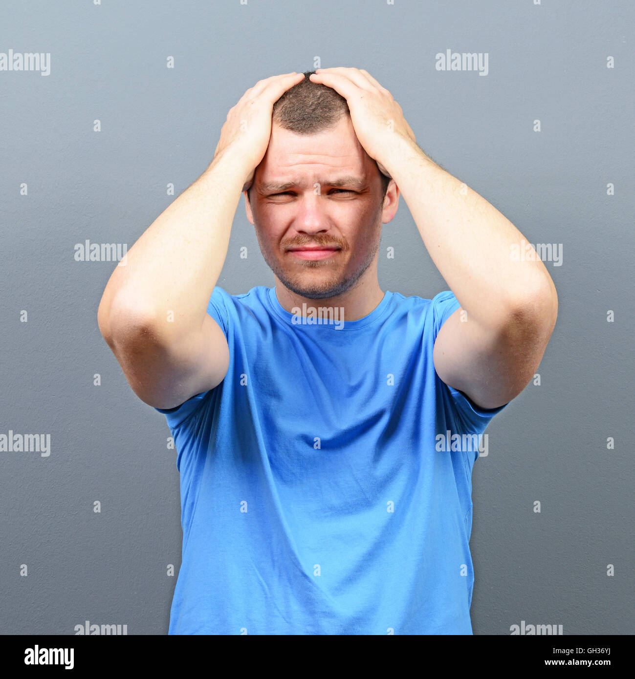 Portrait of a man suffering from headache Stock Photo - Alamy