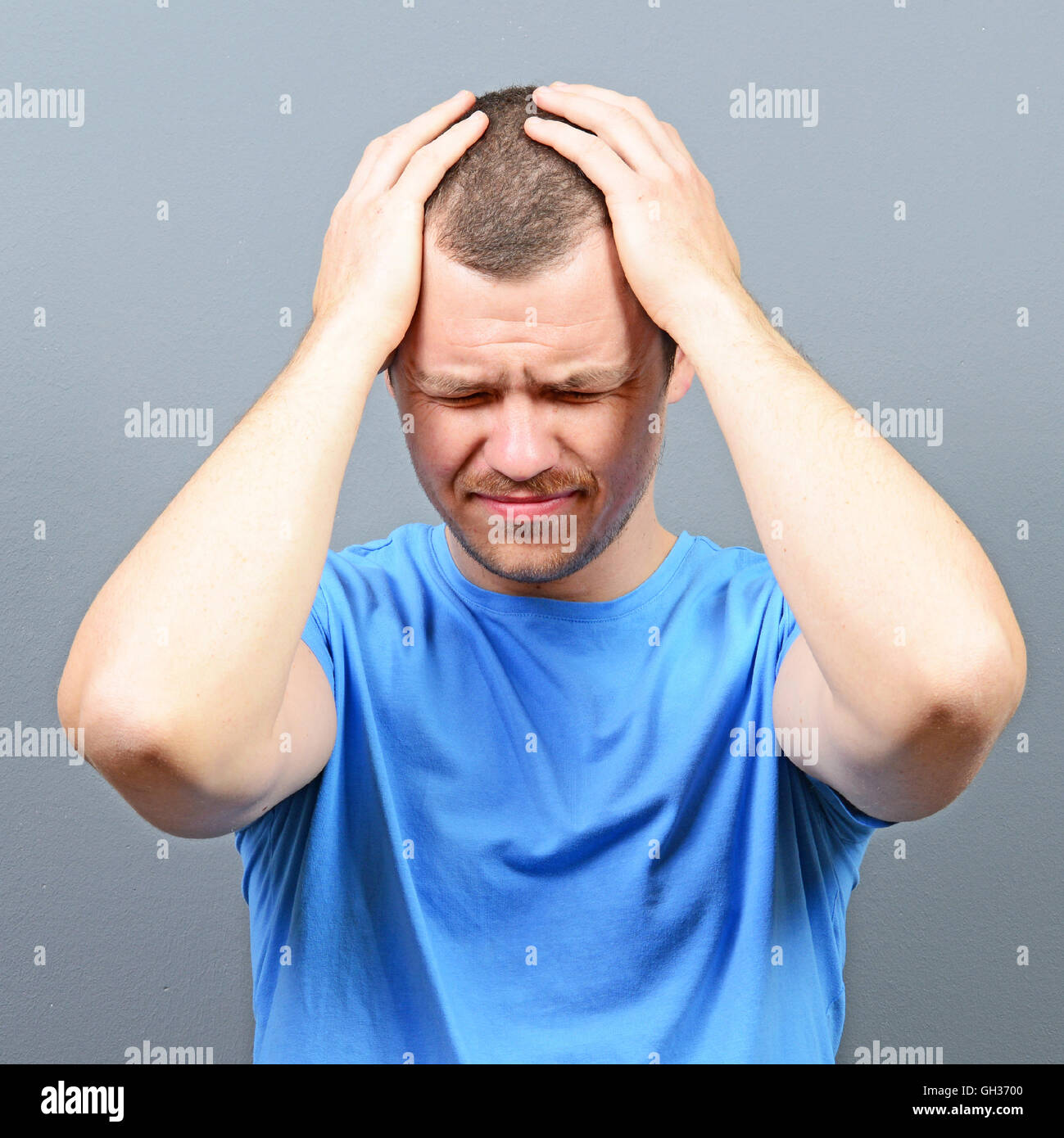 Portrait of a man suffering from headache Stock Photo - Alamy