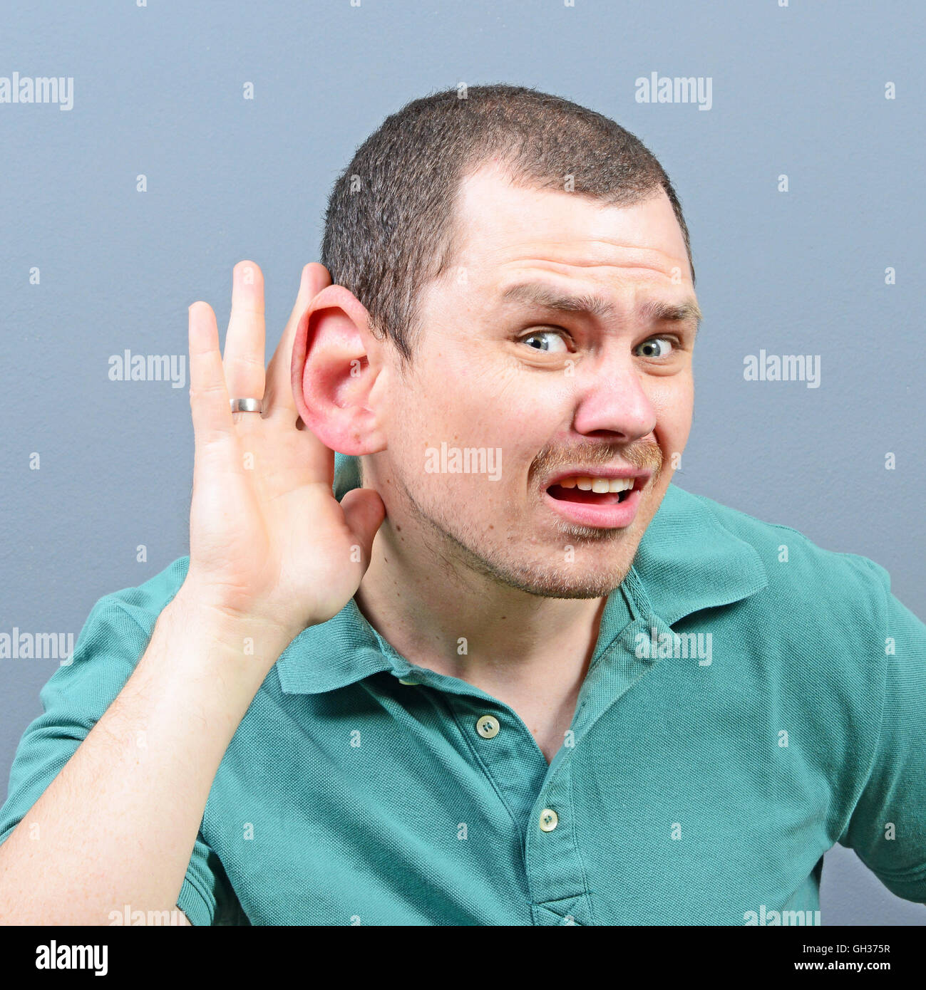 Portrait of man with huge ear listening on private conversation Stock ...