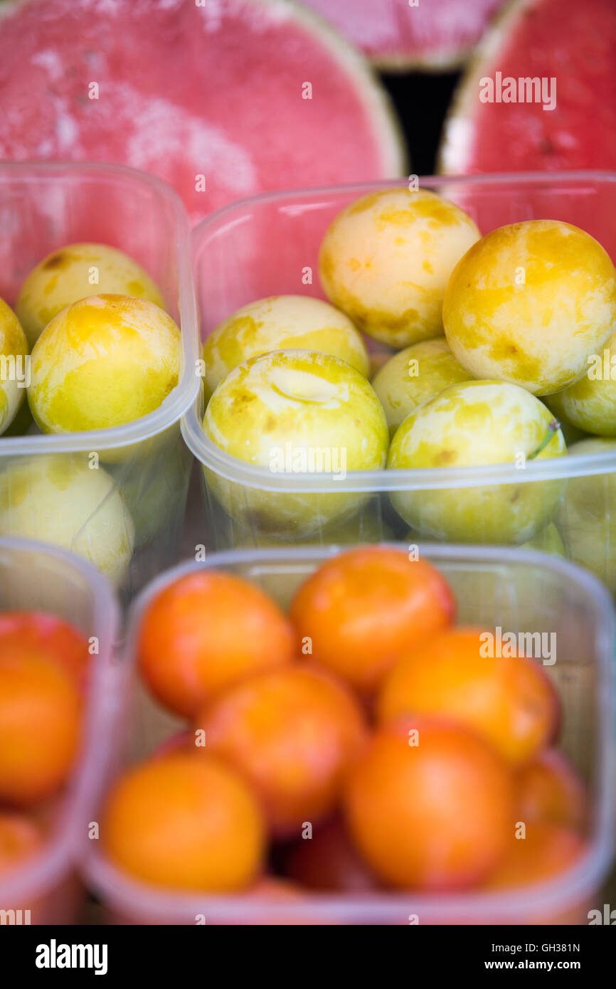 close up of apricots and melons at fruit stand Stock Photo - Alamy