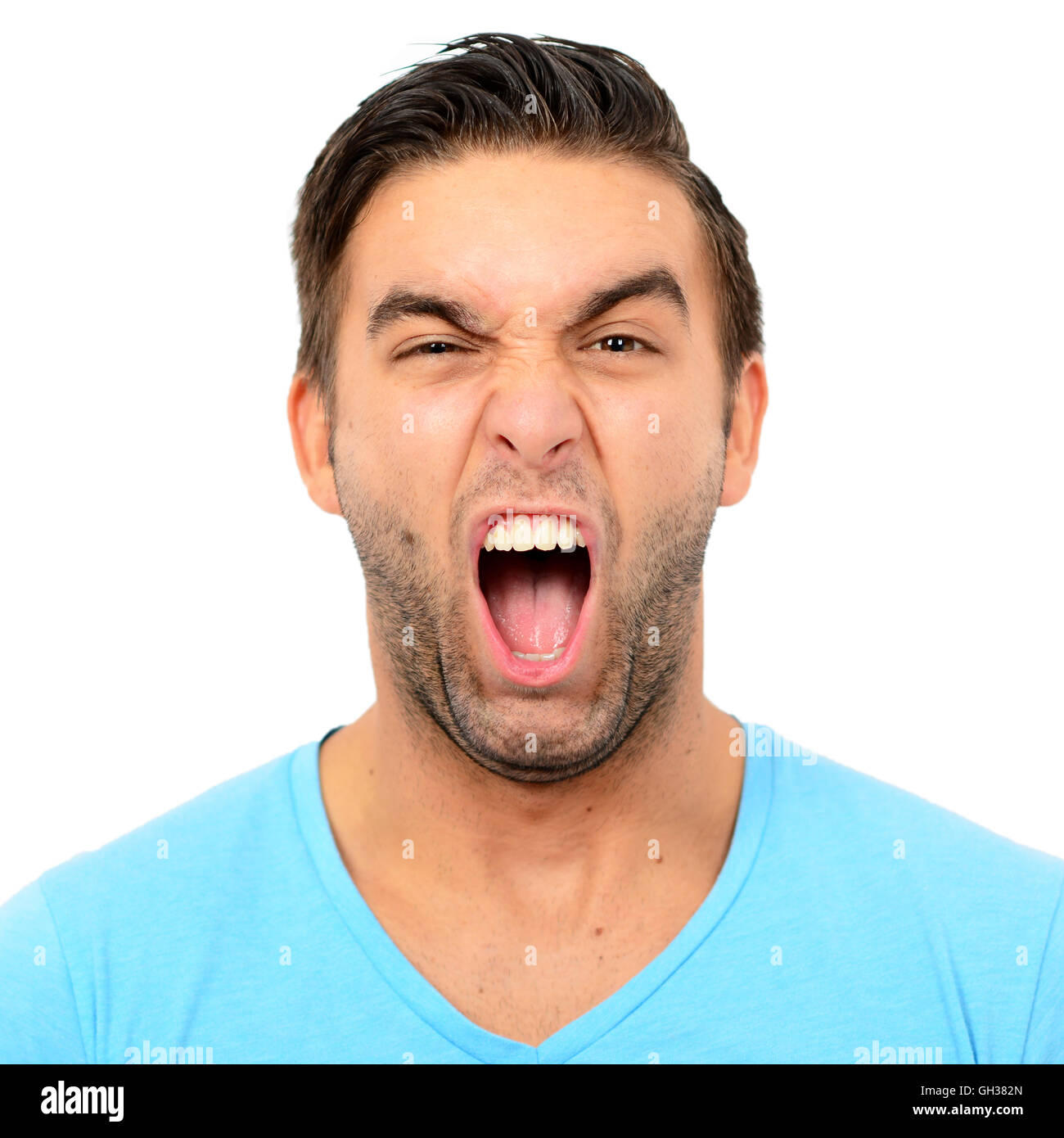 Portrait of angry man screaming against white background Stock Photo ...
