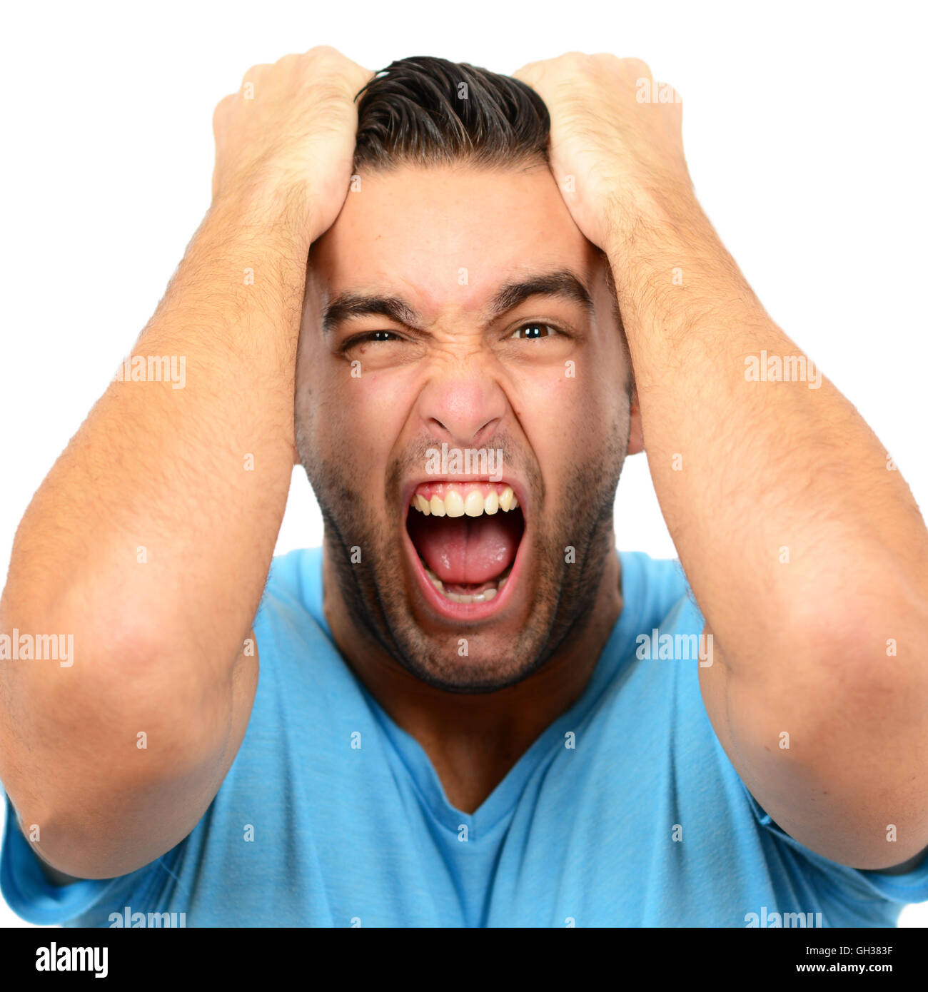 Portrait of angry man screaming and pulling hair against white ...