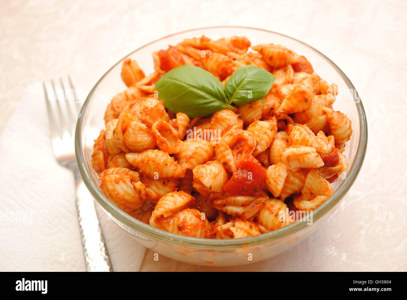 A Glass Bowl Filled with Shell Pasta with Tomato Sauce Stock Photo - Alamy