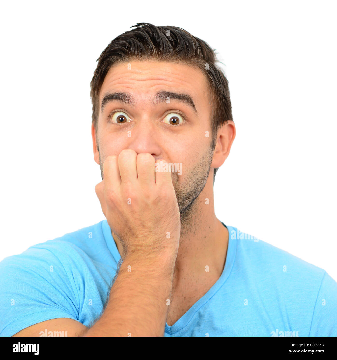 Portrait of man biting nails against white background Stock Photo - Alamy