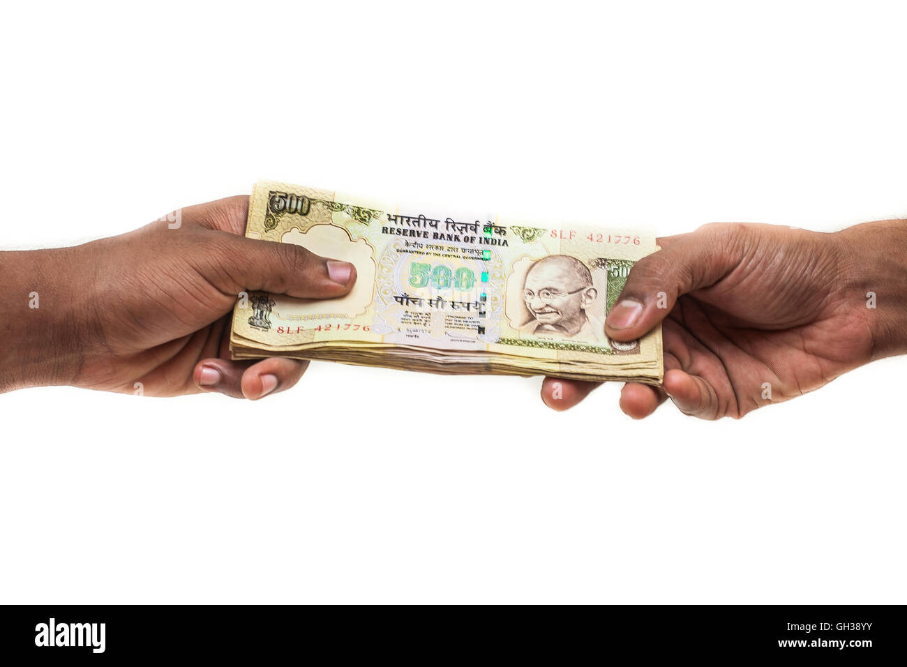 A thick stack of Indian 500 rupee notes changing hands - isolated on ...