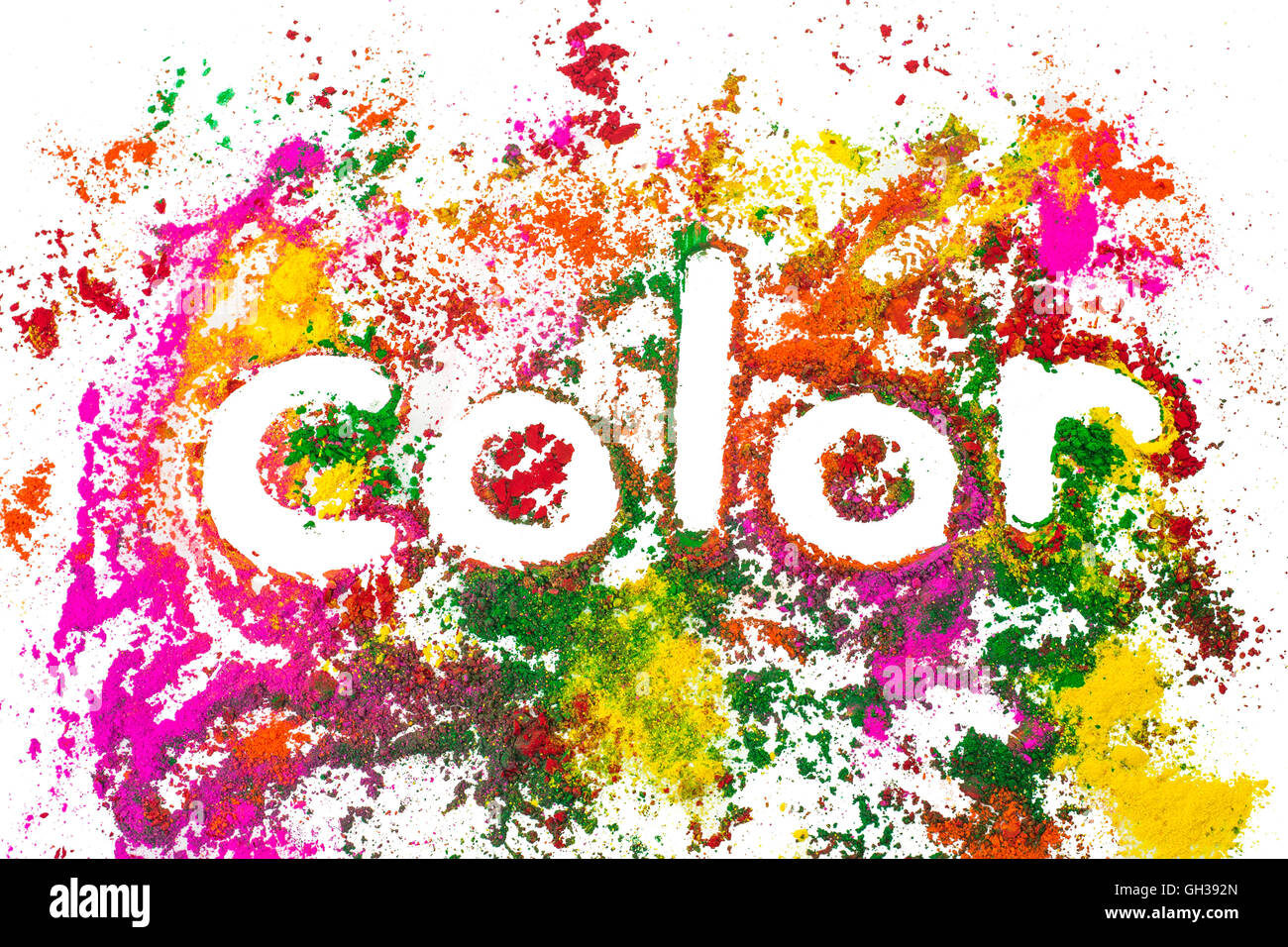 The word "COLOR" spelled out in a mess of colored dye powder Stock ...