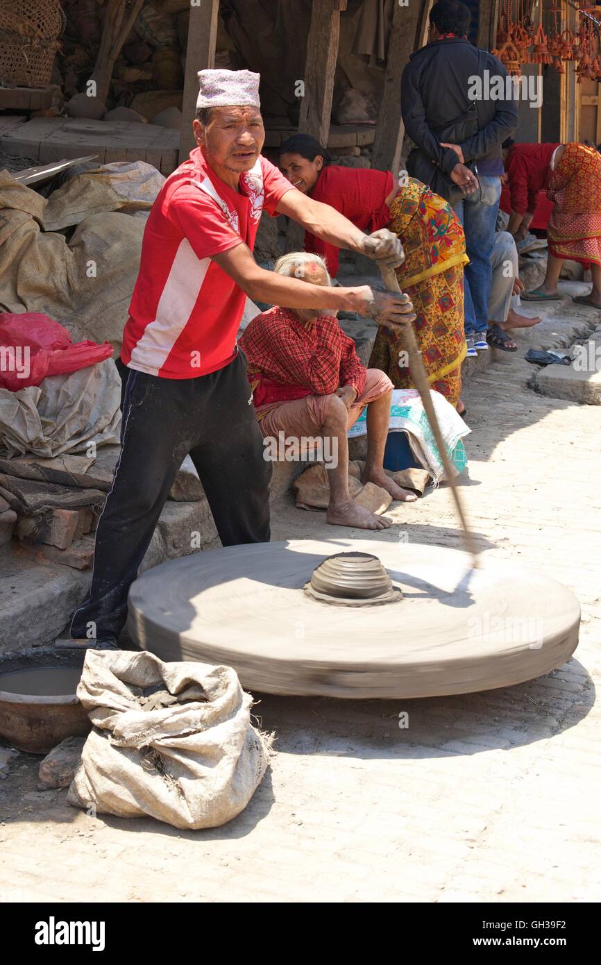 Potter turning potter's wheel, Potter's Square, Bhaktapur, Nepal, Asia ...