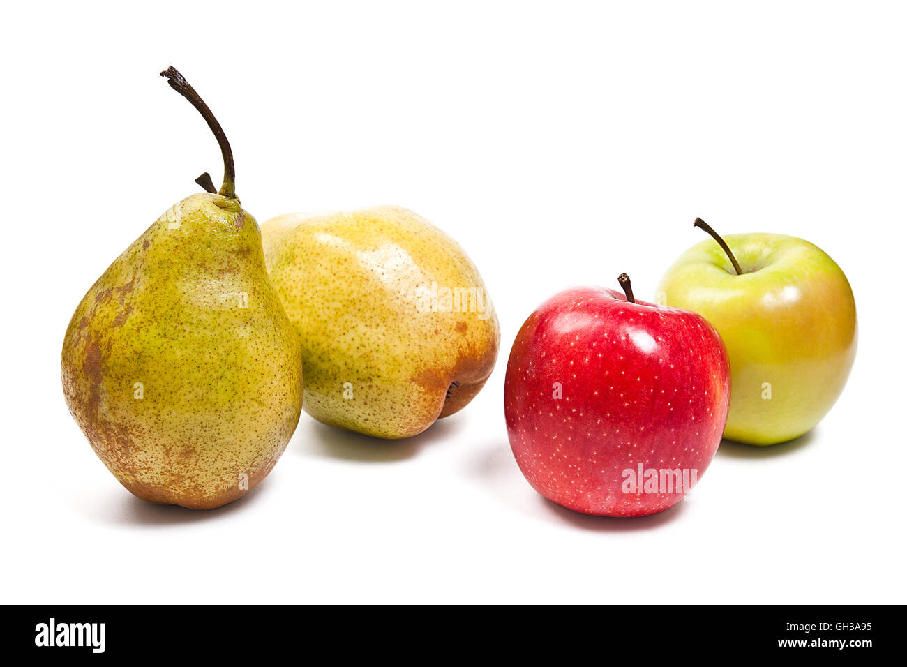 Two fresh green pears and two apples in red and green color. With ...