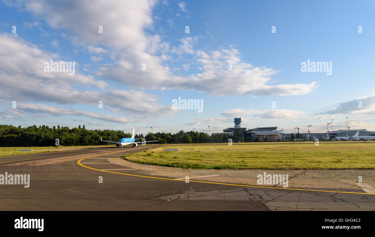 Airplane Taking Off On Airport Runway Stock Photo - Alamy