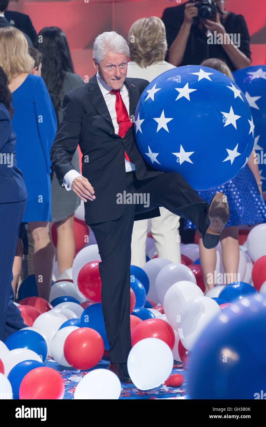 Former President Bill Clinton kicks balloons during the finale of the ...