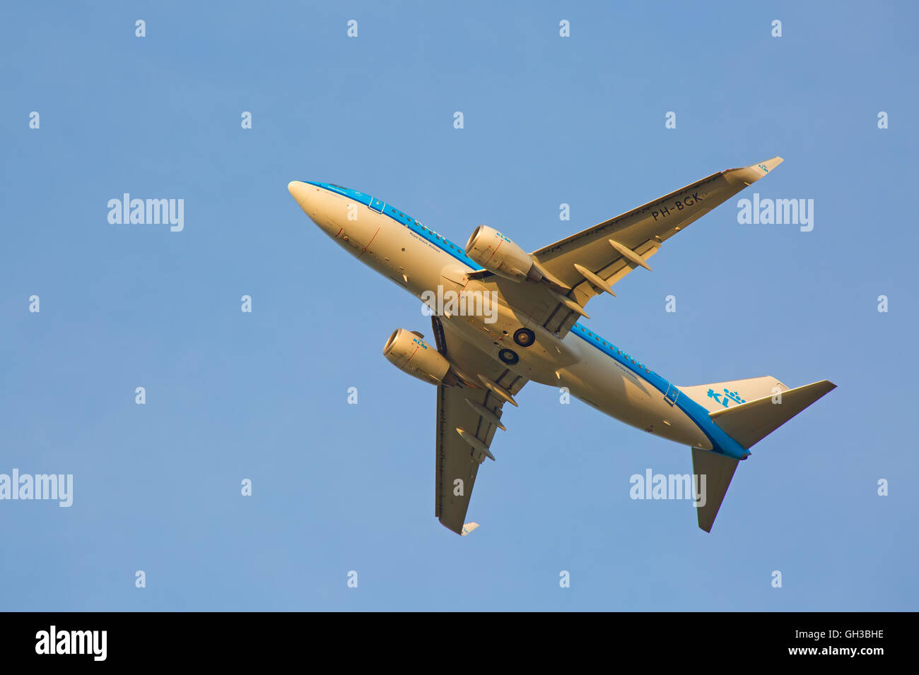 ZURICH - JULY 18: Boeing-737 KLM taking off at sunset from Zurich after ...