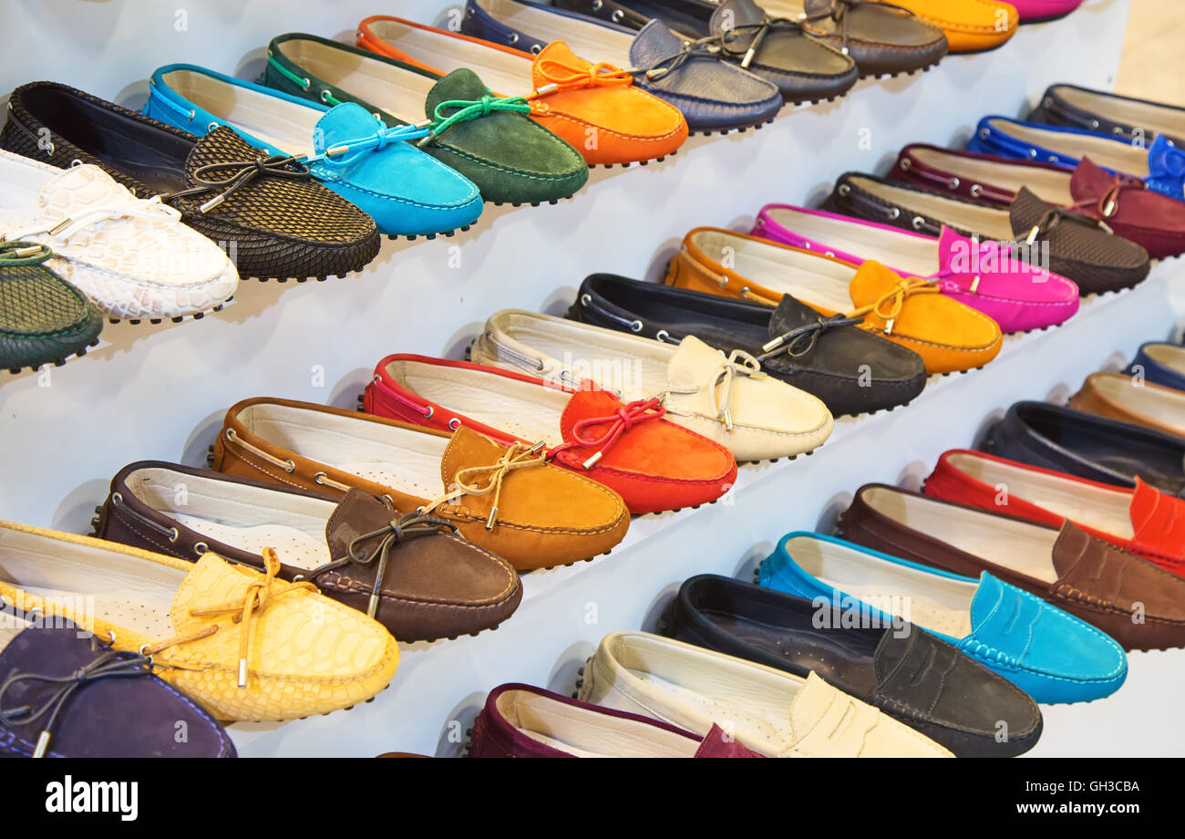 variety of the colorful leather shoes in the shop Stock Photo - Alamy
