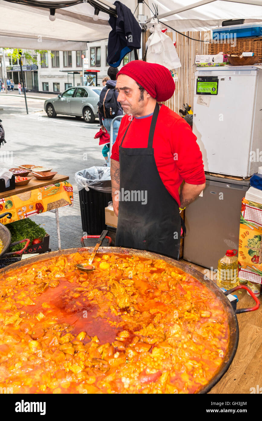 Large trays of yellow curry being cooked in a stall at the Southbank ...