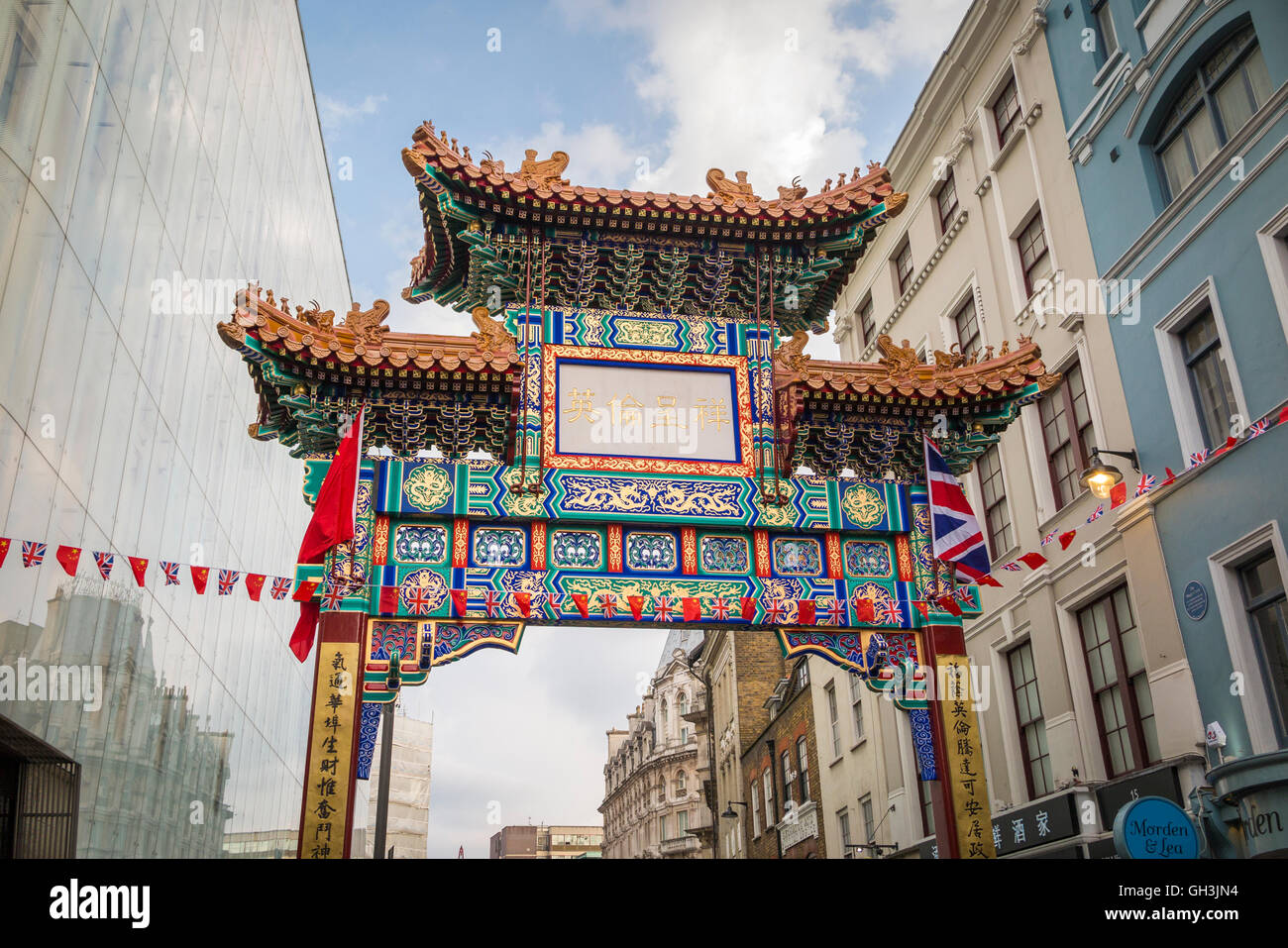 Entrance sign and gate in Wardour Street at Chinatown, West End ...