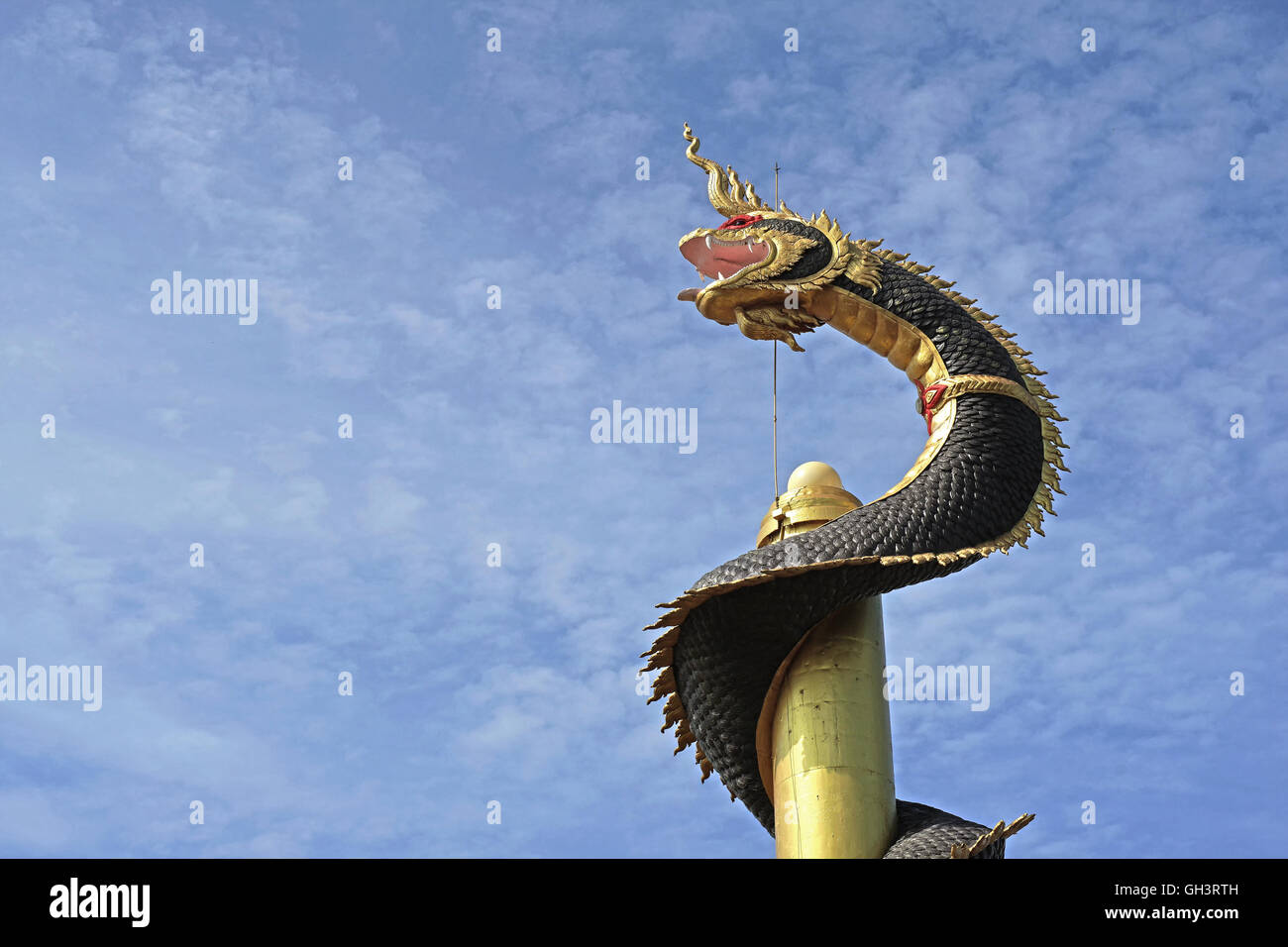 serpent or big snake statue with beautiful sky background Stock Photo ...