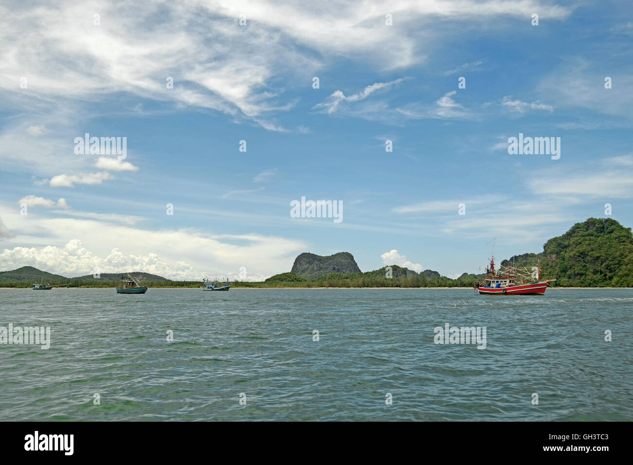 landscape view of ocean with fishing boat and beautiful sky background ...