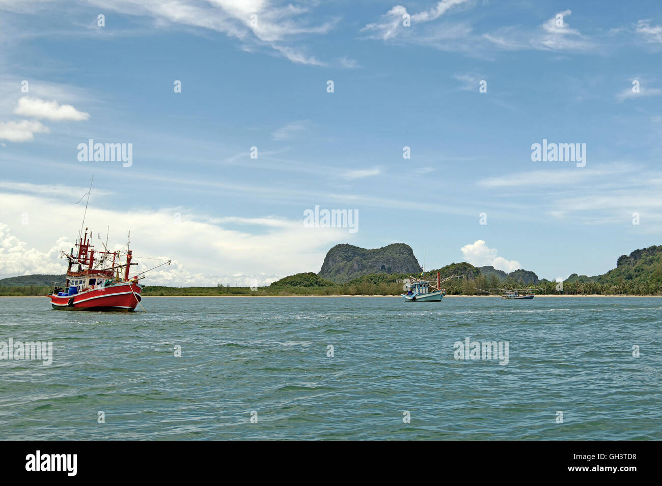 landscape view of ocean with fishing boat and beautiful sky background ...