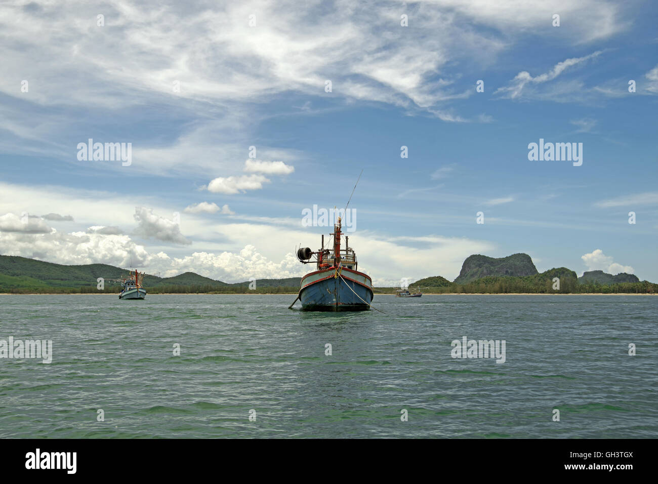 landscape view of ocean with fishing boat and beautiful sky background ...