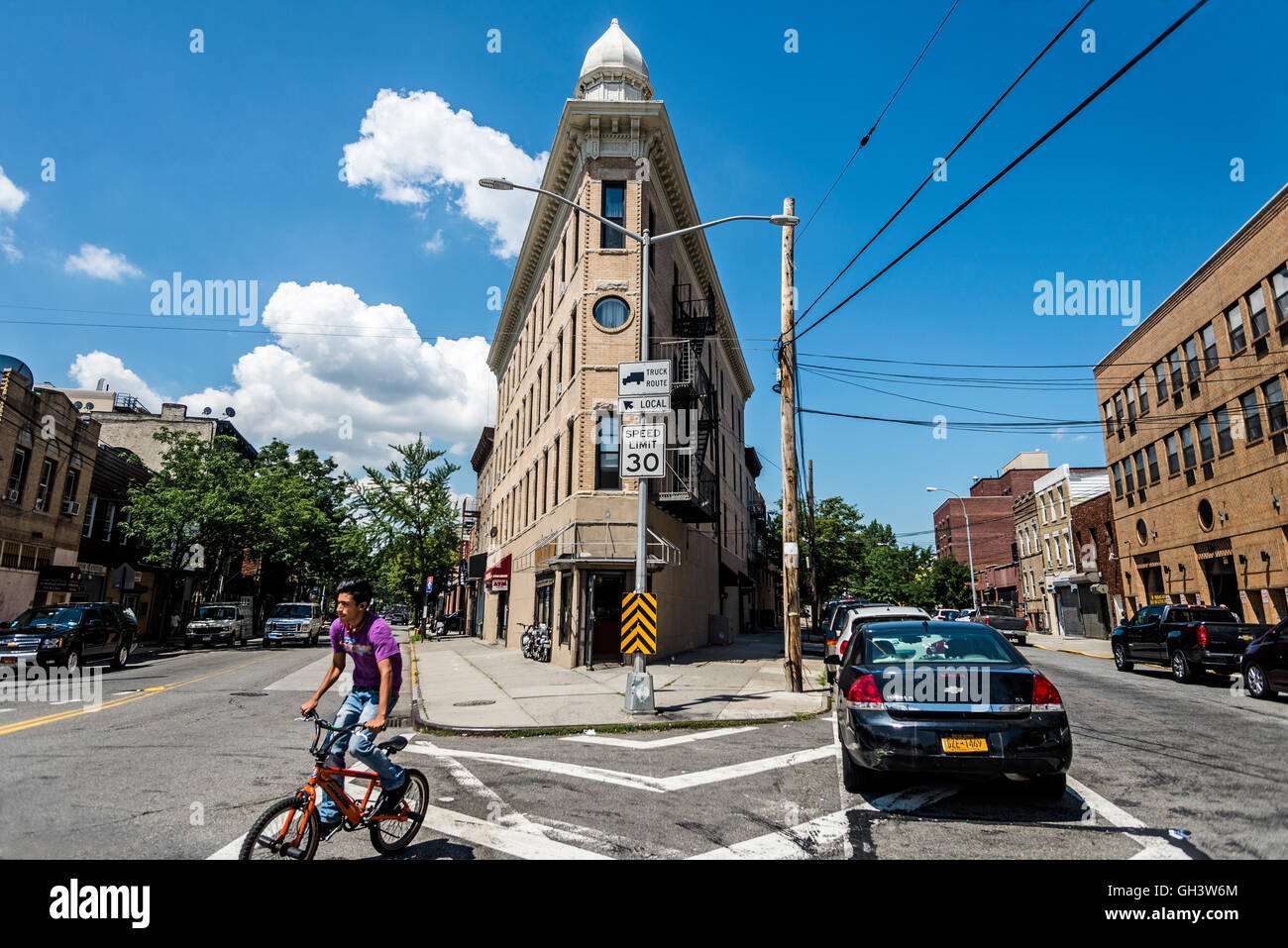 Astoria, Queens, New York - 3 August 2016 - Man on a bicycle in the old ...
