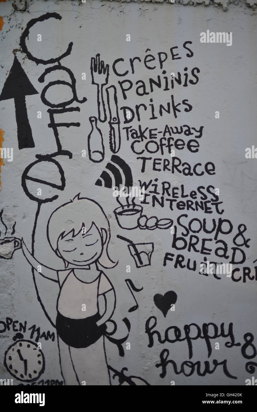 menu for a cafe graffitied on a wall in Reykjavik Iceland Stock Photo ...