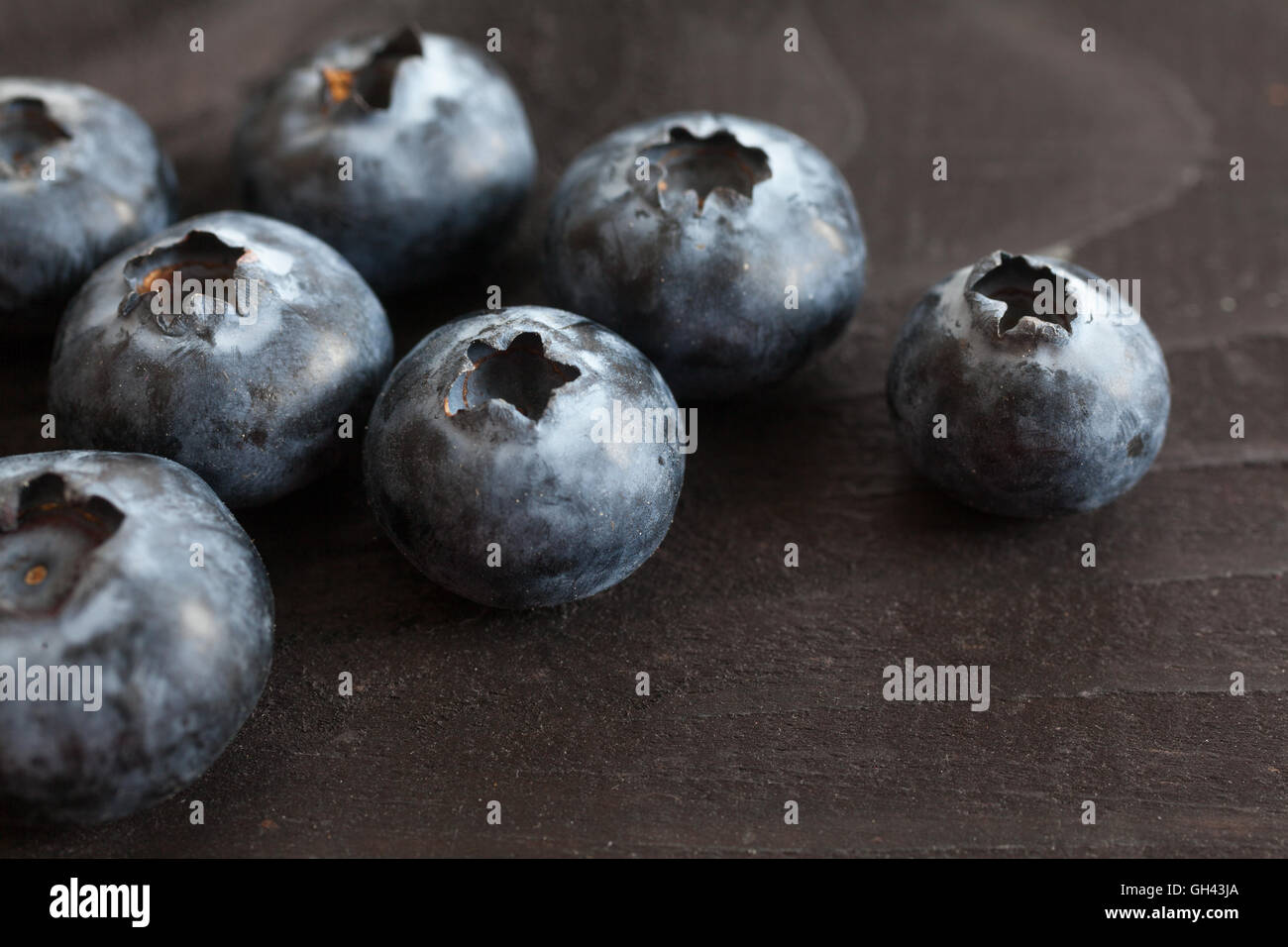 Blueberry on wooden table background Stock Photo - Alamy