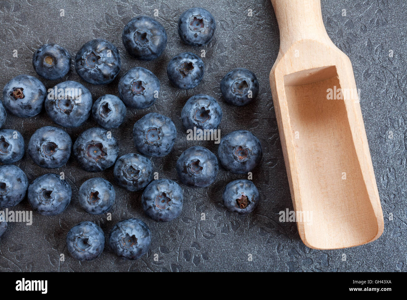Blueberry in scoop on wooden table background Stock Photo - Alamy