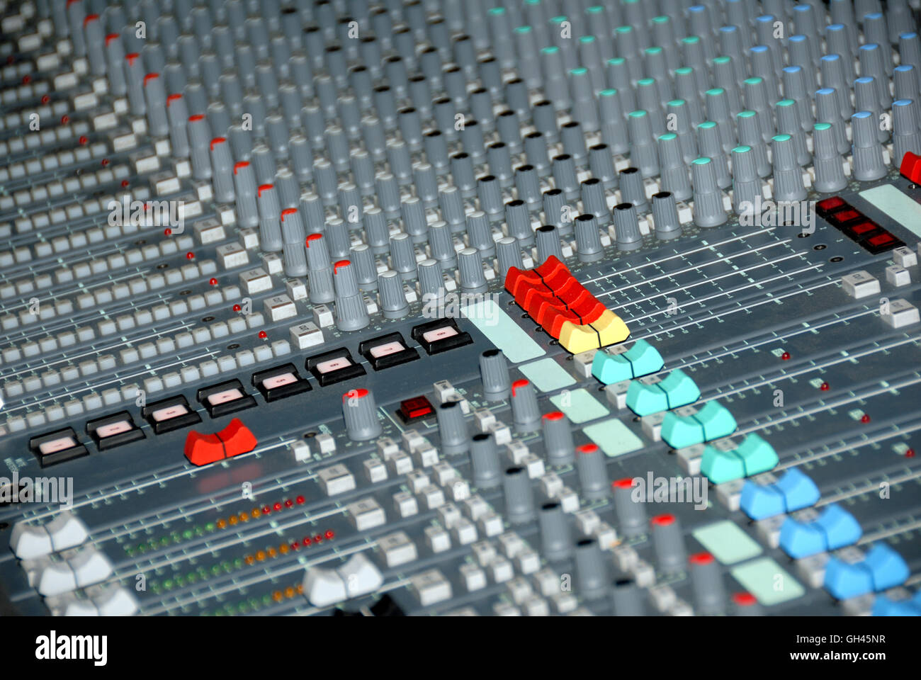 Audio mixing console in a recording studio. Faders and knobs of a sound ...