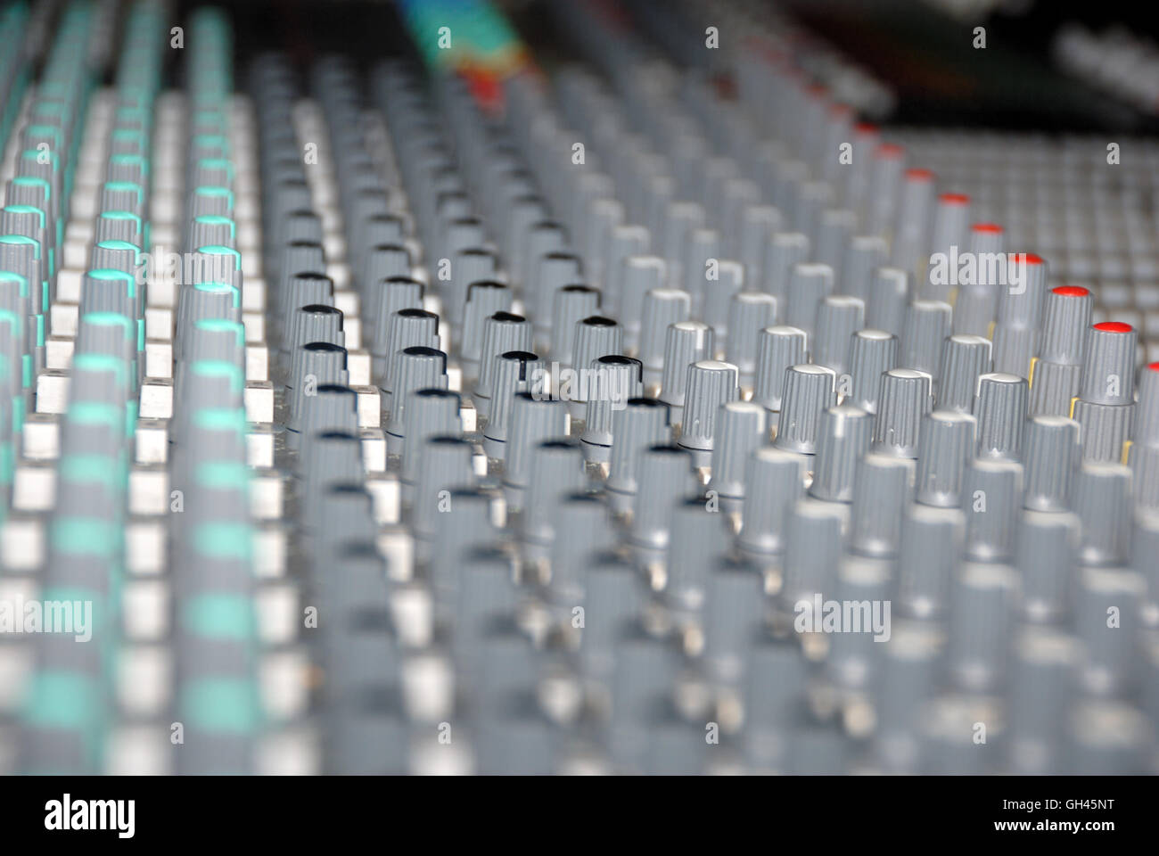 Audio mixing console in a recording studio. Faders and knobs of a sound ...