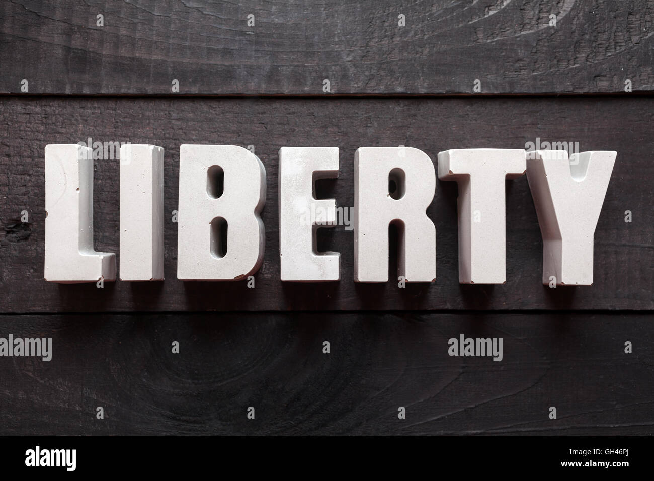 Letters from cement forming the word "Liberty Stock Photo - Alamy