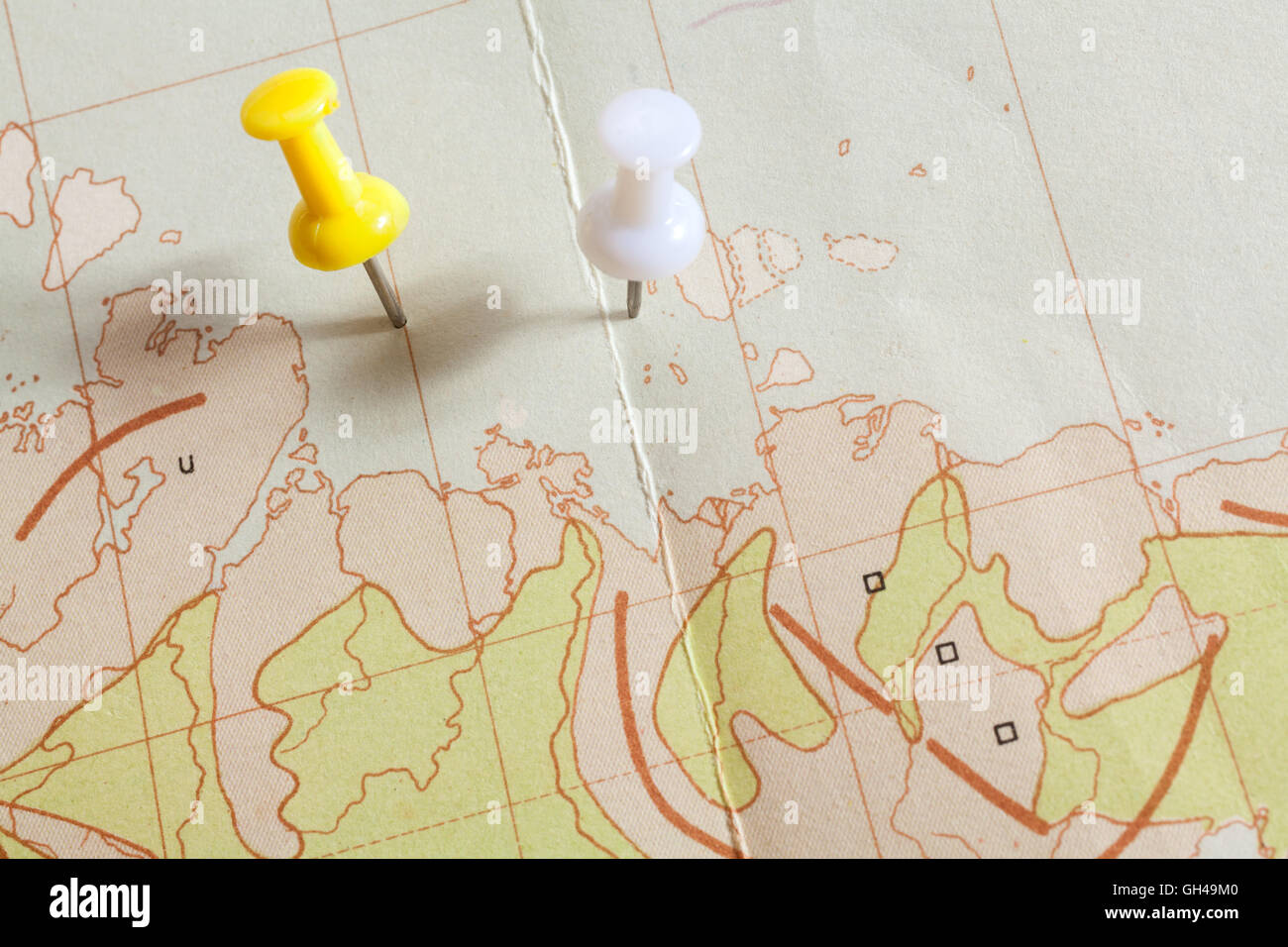 Push pins showing the location of a destination point on a map Stock ...