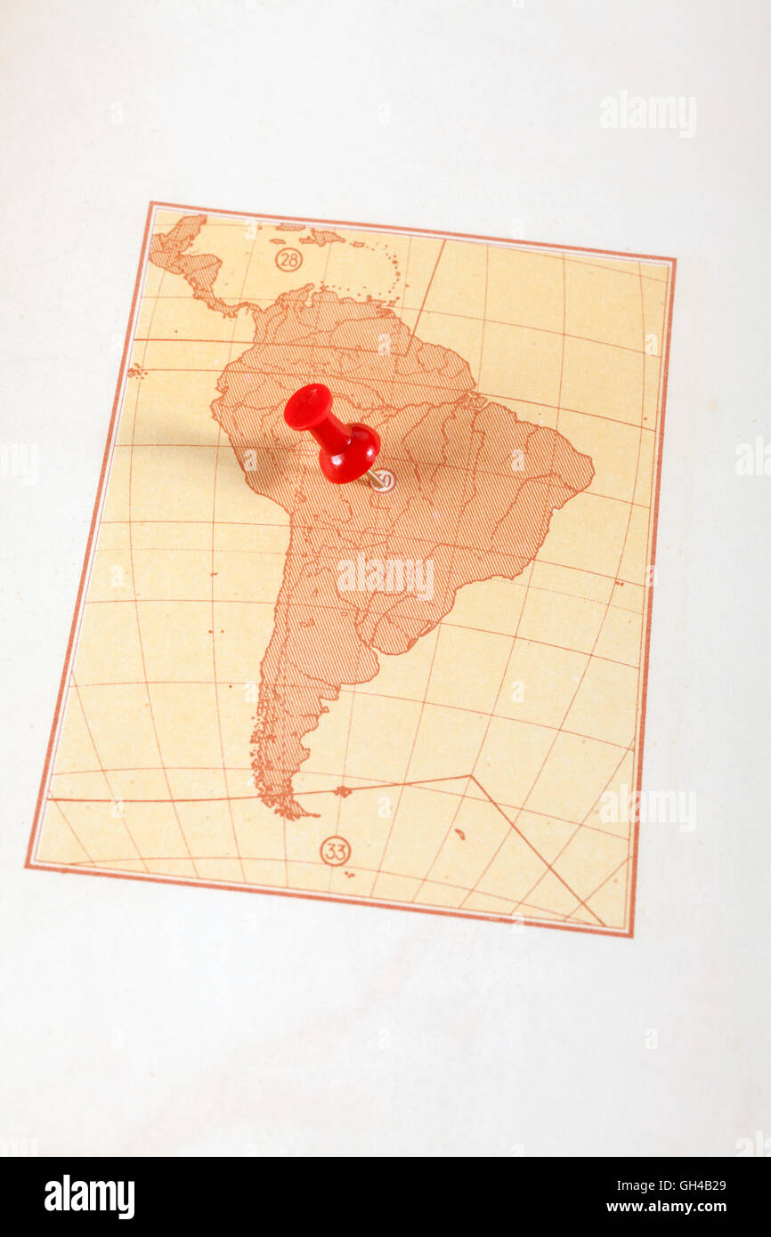 Red push pin showing the location of a destination point on a map ...