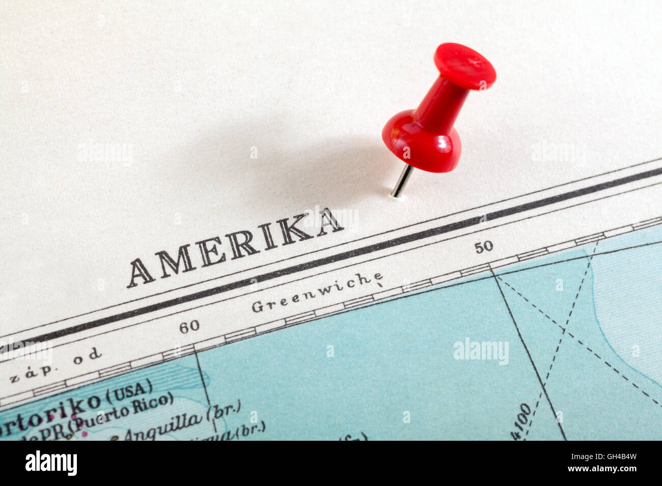 Red push pin showing the location of a destination point on a map ...