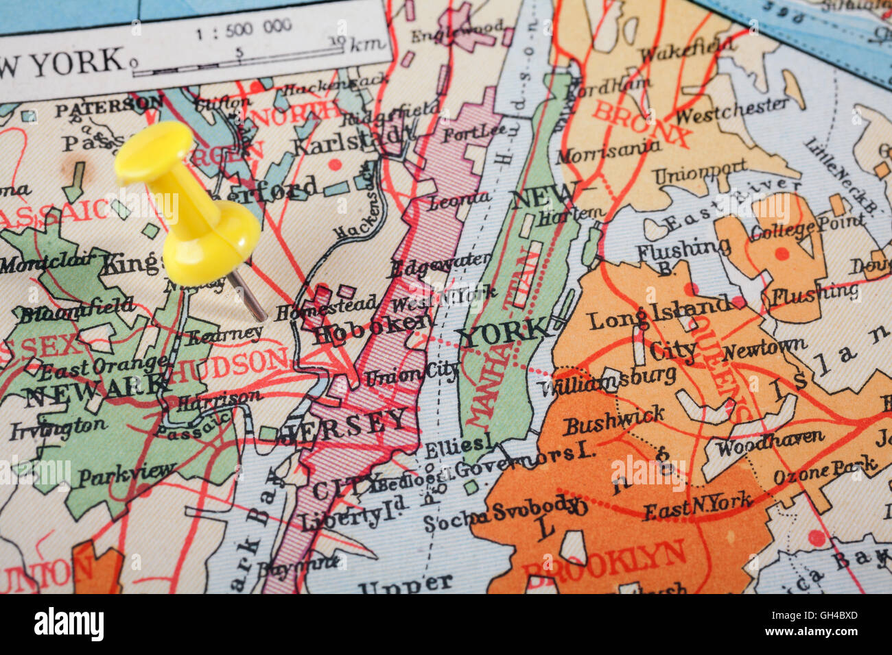 Red push pin showing the location of a destination point on a map. New ...