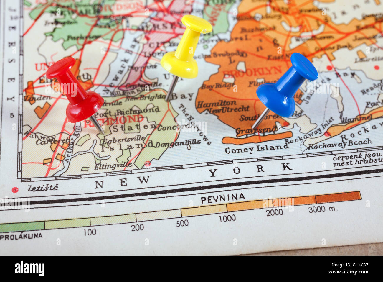 Red push pin showing the location of a destination point on a map. New ...