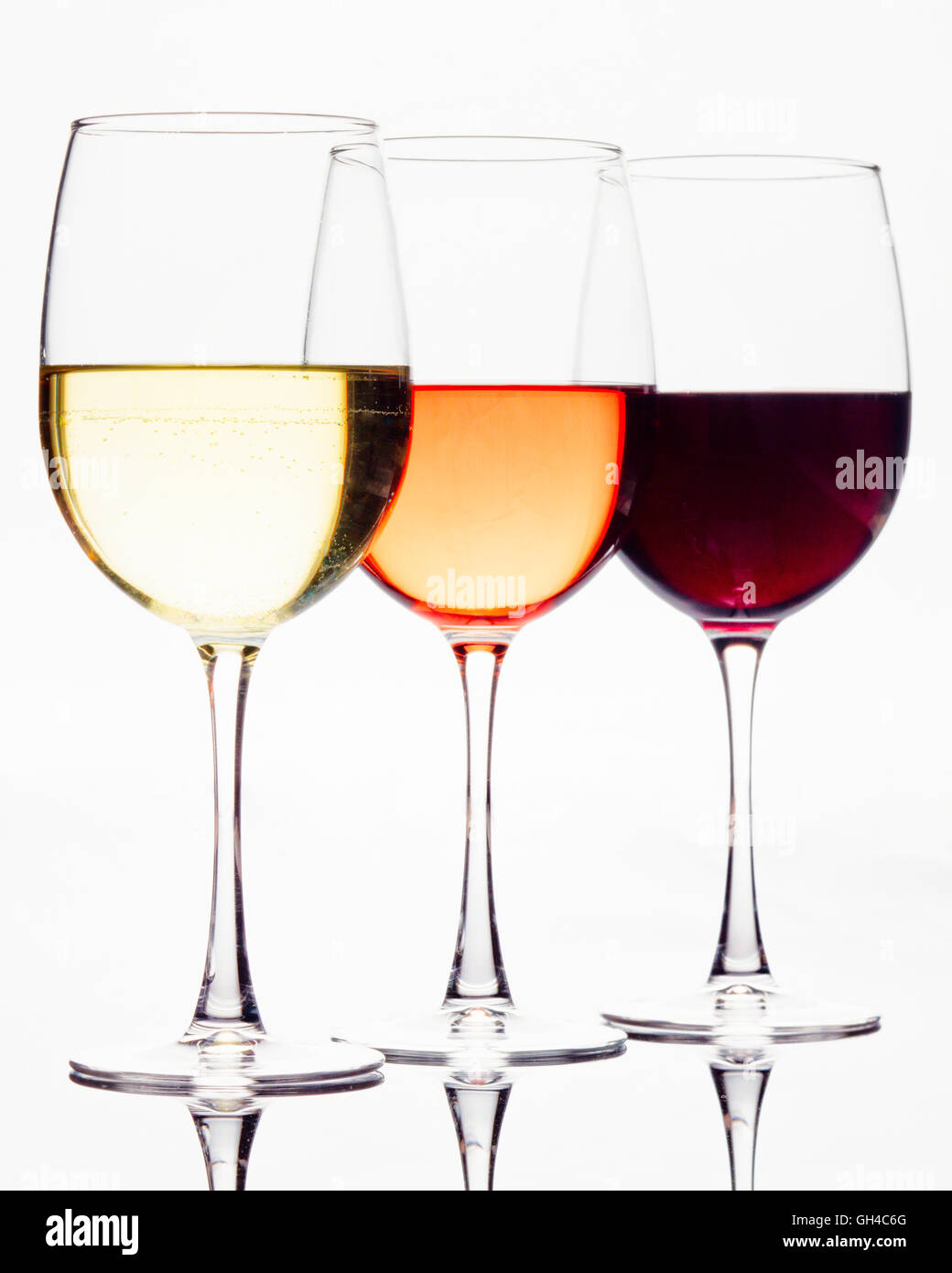 High Key Image Of Three Wine Glasses Filled With White Rose And Red