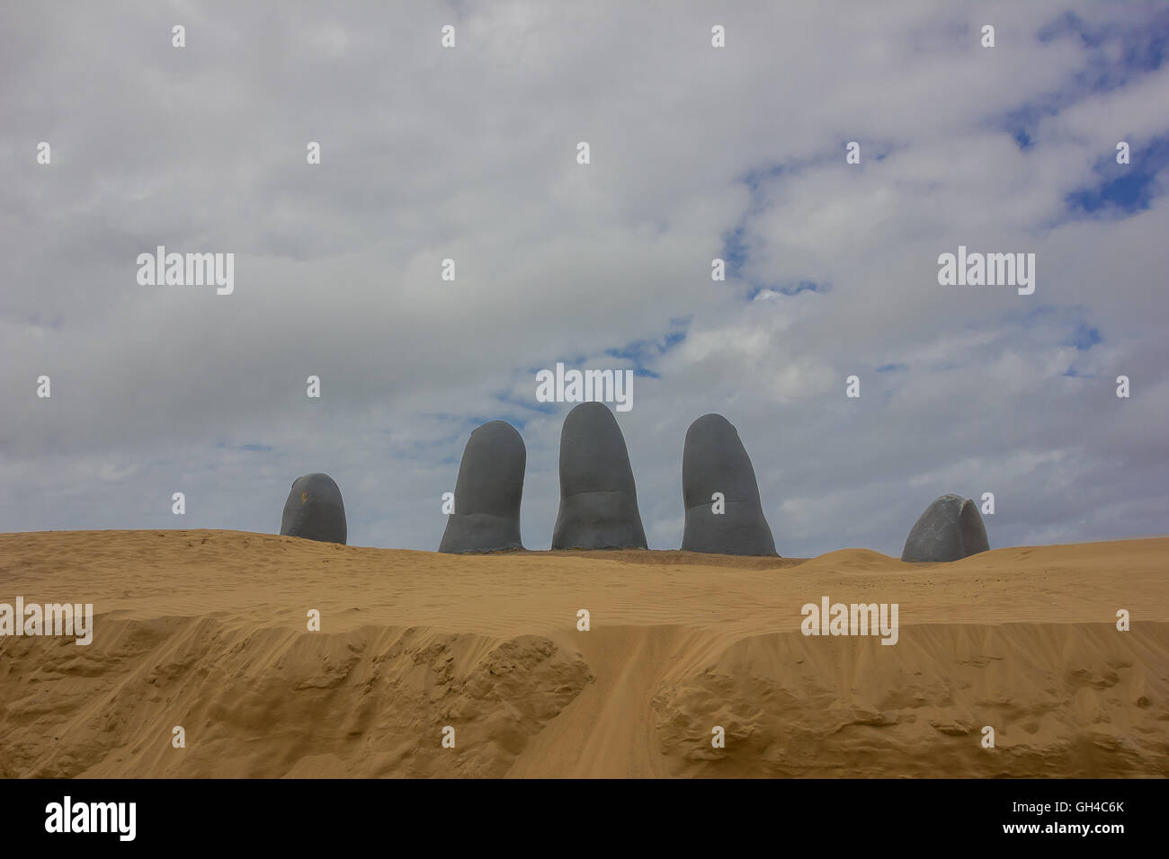 Hand in the sand sculpture hi-res stock photography and images - Alamy