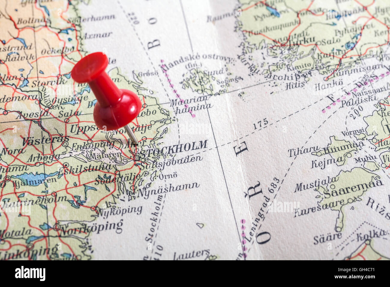Red push pin showing the location of a destination point on a map ...