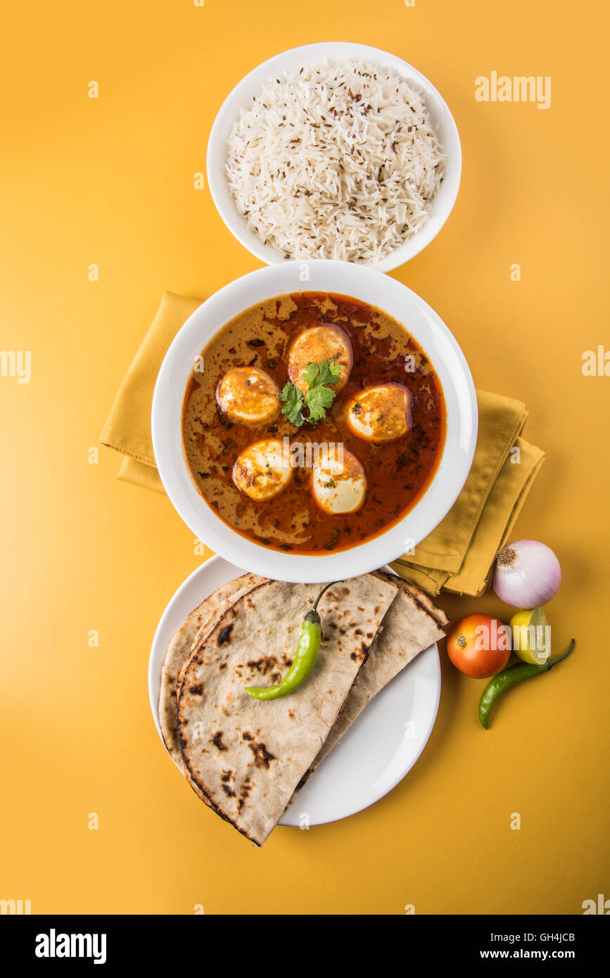 egg curry with roti/chapati and jeera rice, tasty and spicy anda curry ...