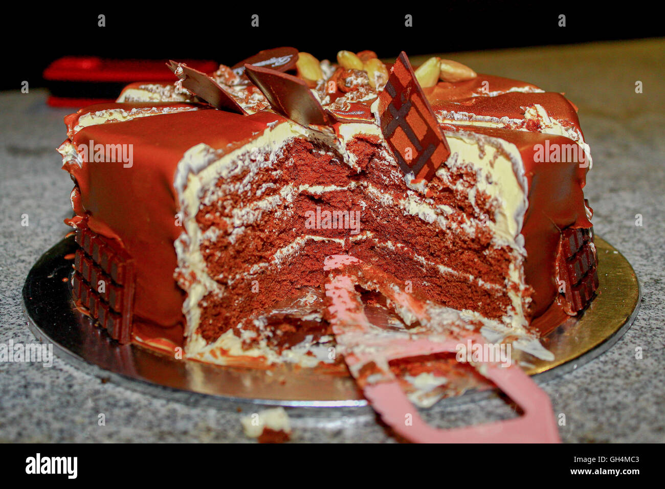 Chocolate cake with knife Stock Photo - Alamy