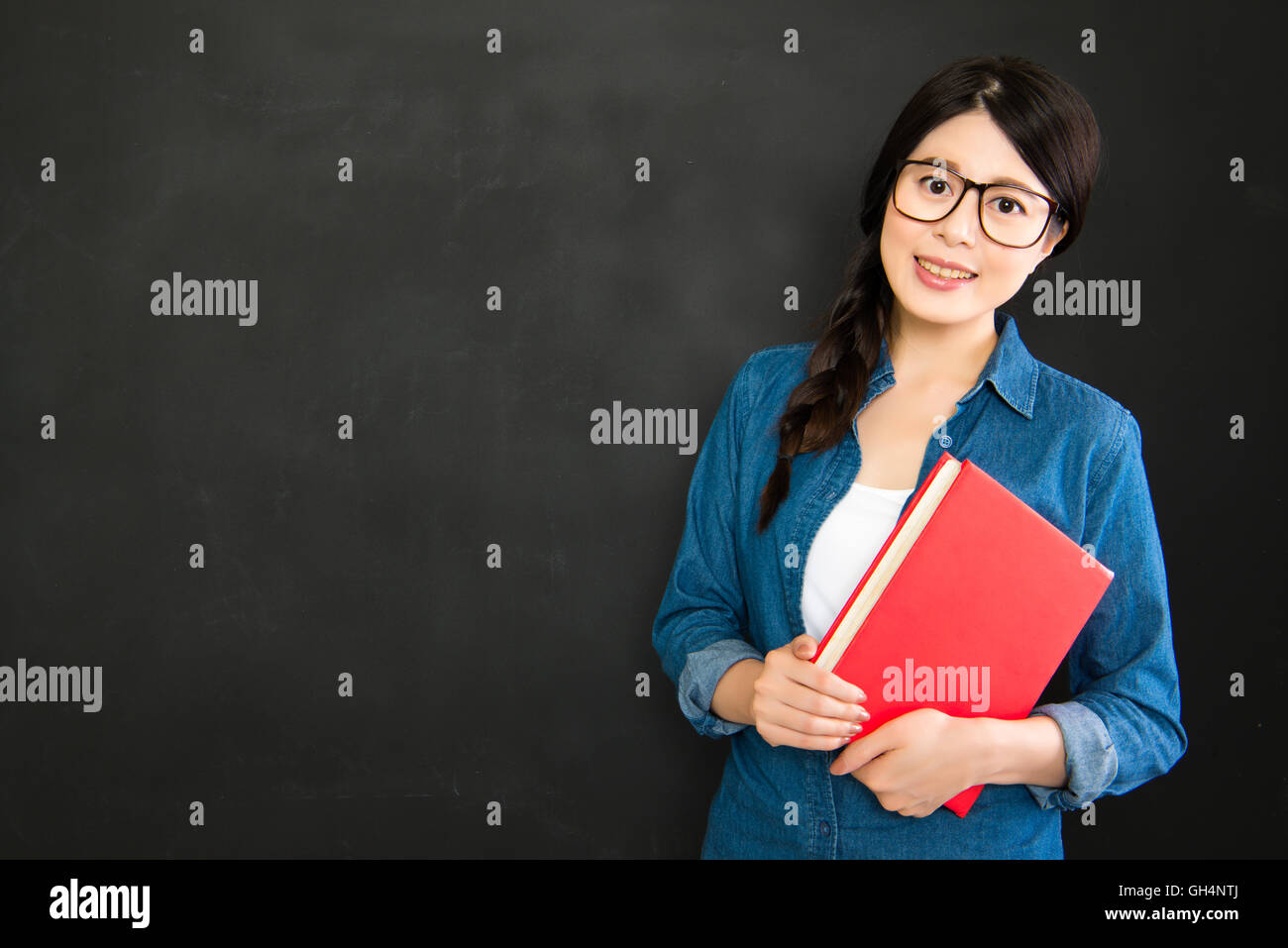 Young aisan student in front of blackboard back to school Stock Photo ...