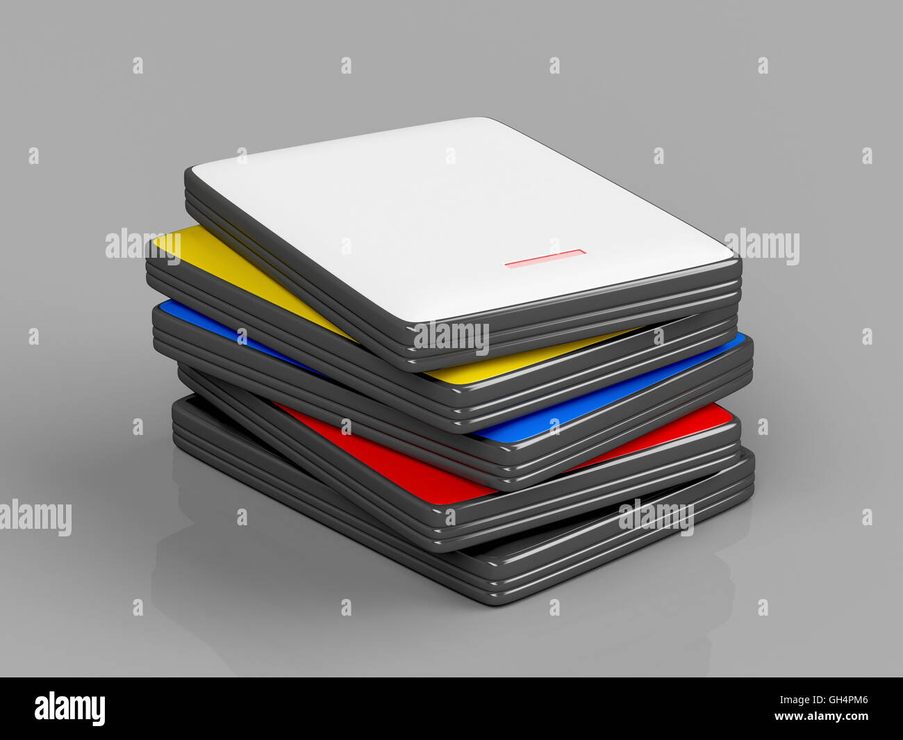 Stack with portable hard drives with different colors on shiny gray ...
