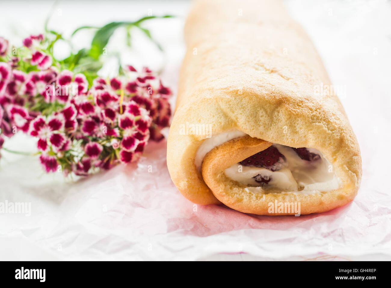 vanilla roulade with cream and a bouquet of carnations Turkish Stock ...
