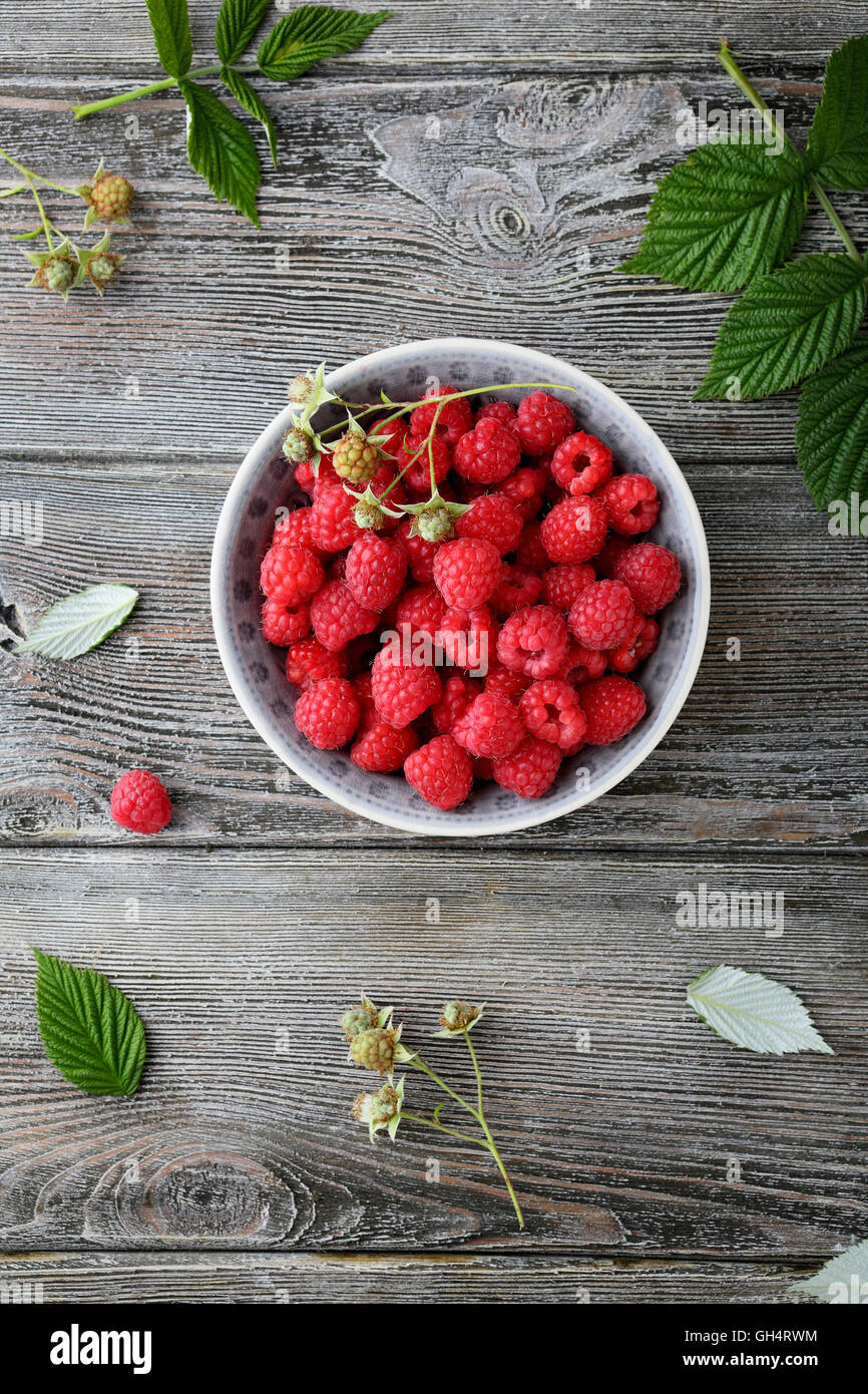 fresh raspberry in bowl top view, summer berry Stock Photo - Alamy