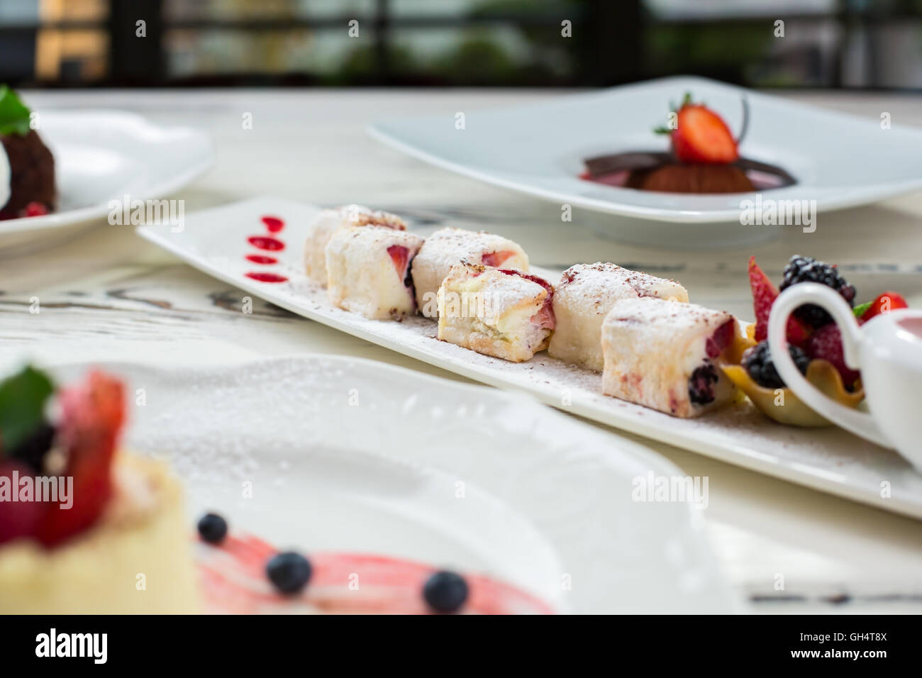 Plate with pieces of dessert Stock Photo - Alamy