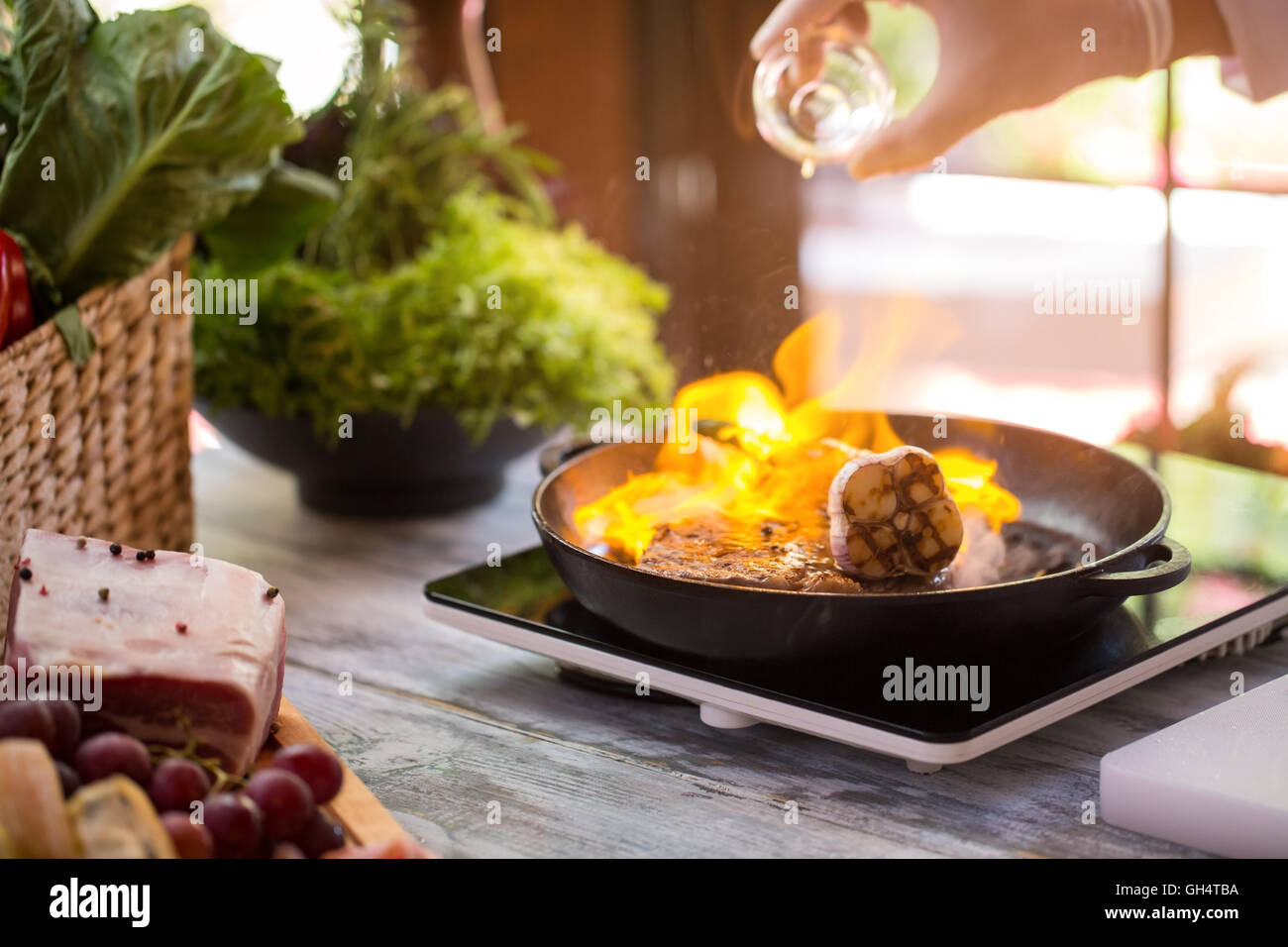Flame in frying pan Stock Photo - Alamy