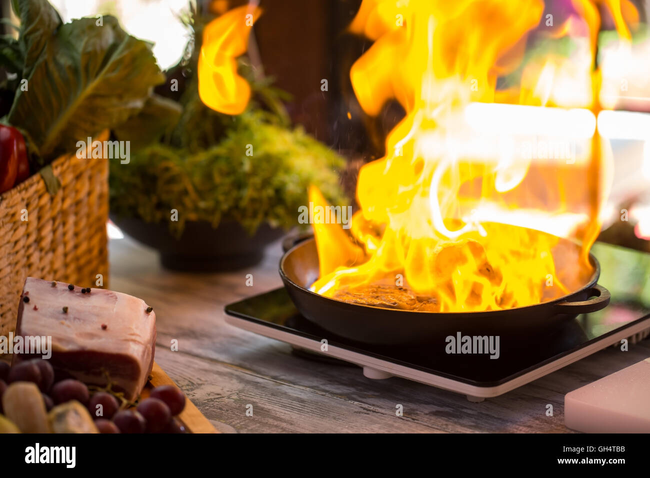 Fire in pan Stock Photo - Alamy